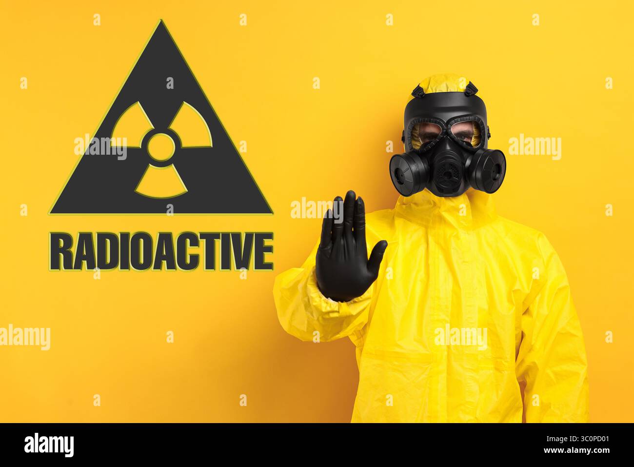 Man in hazmat suit and gas mask showing stop gesture on orange ...