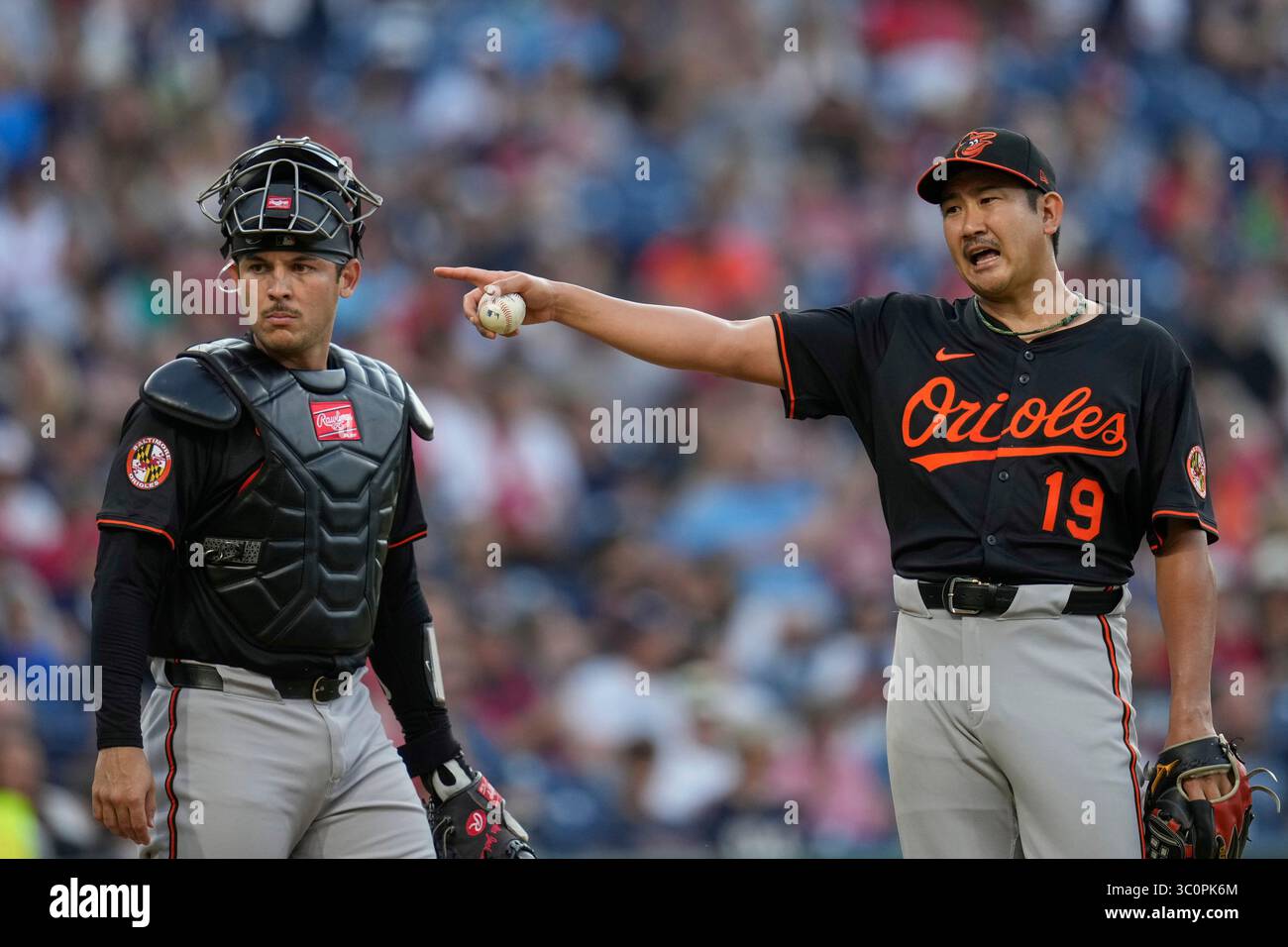 Baltimore Orioles' Tomoyuki Sugano (19) gestures in front of catcher ...