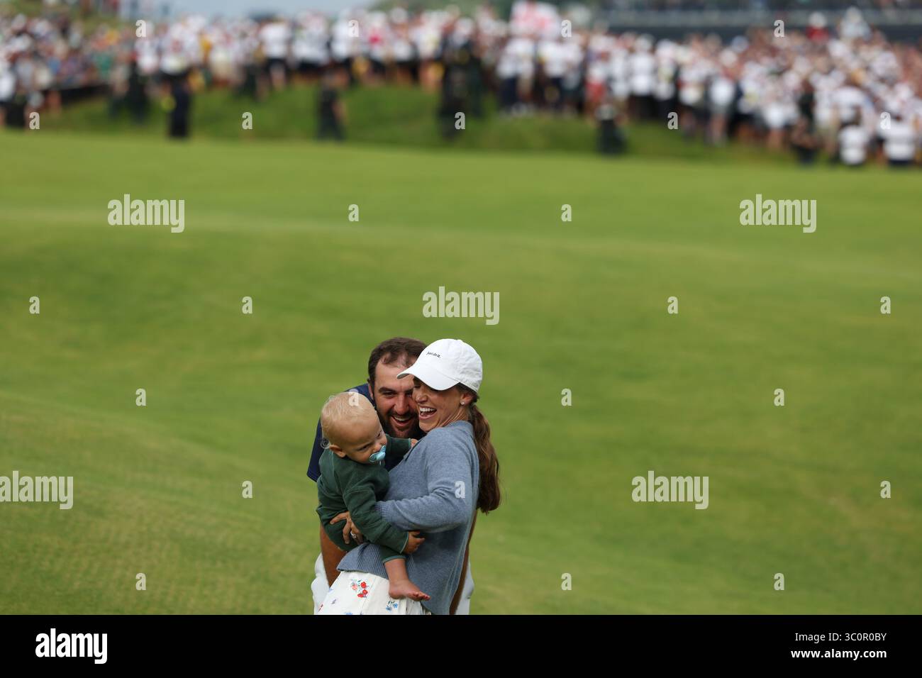 United States' Scottie Scheffler celerates with his wife Meredith and ...