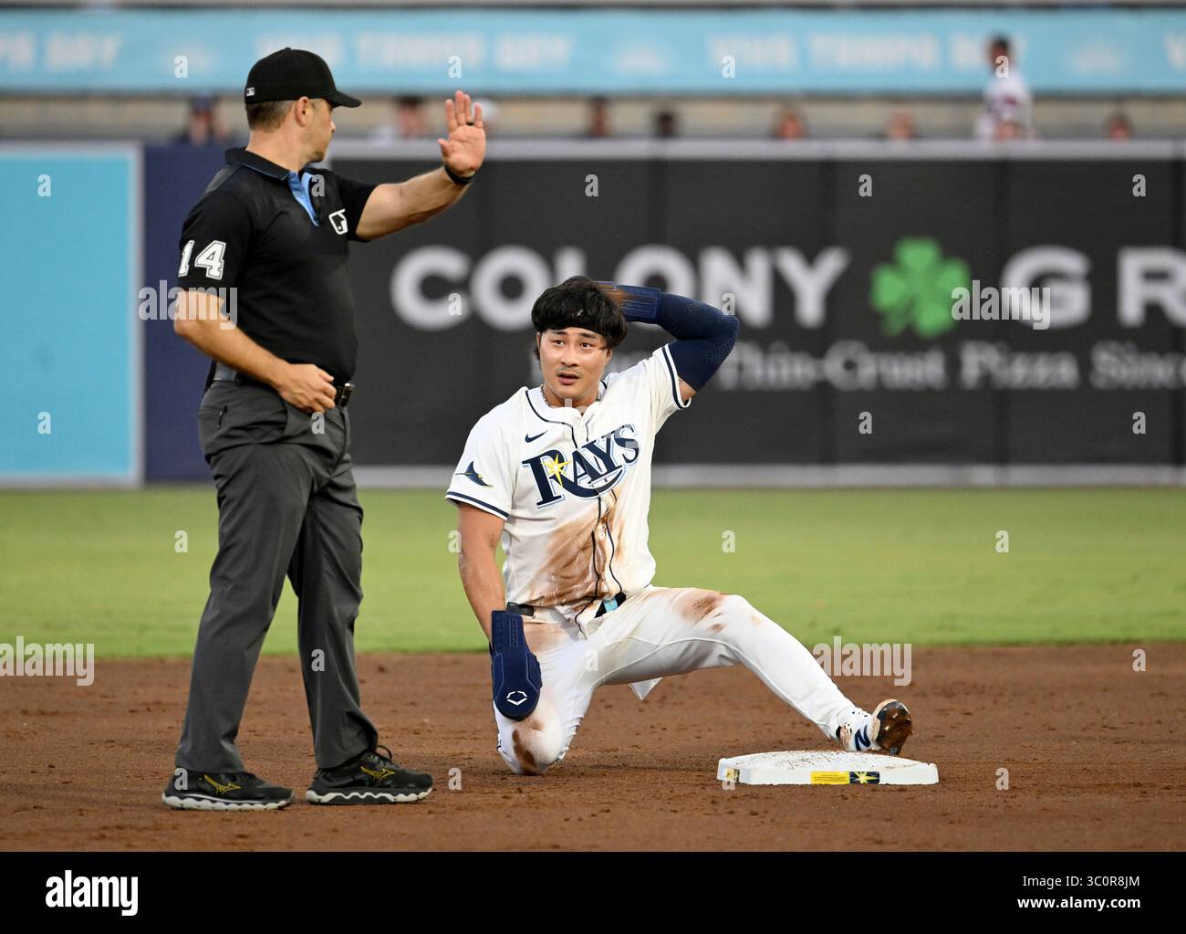 Second base umpire Mark Wegner (14) calls time after Tampa Bay Rays' Ha ...