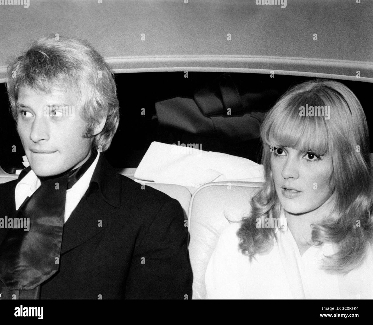 Bulgarian-born French singer Sylvie Vartan sitting in a car with her husband, French singer and ...