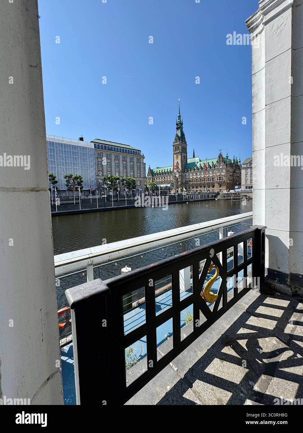 View of Hamburg City Hall (Rathaus) from a balcony by the Alsterfleet ...