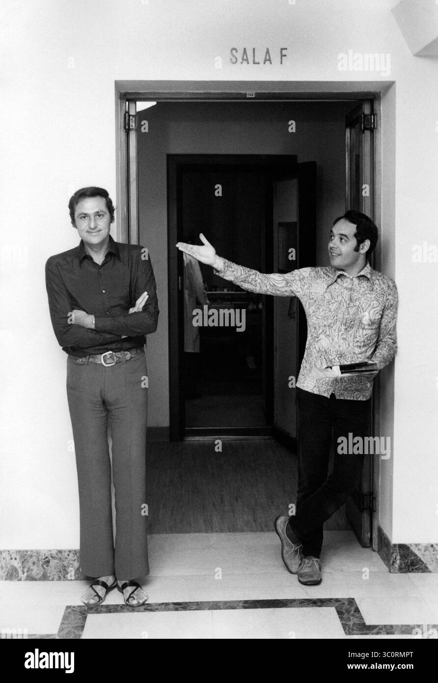 Renzo Arbore and Gianni Boncompagni standing under the entry door of a ...