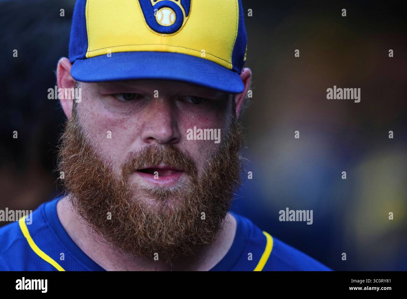 Milwaukee Brewers starting pitcher Brandon Woodruff walks in the dugout ...