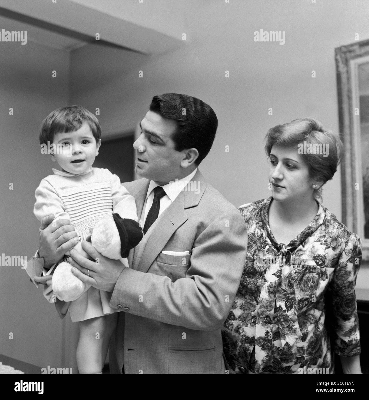 Italian boxer Duilio Loi hugging his daughter beside his wife Grazia ...