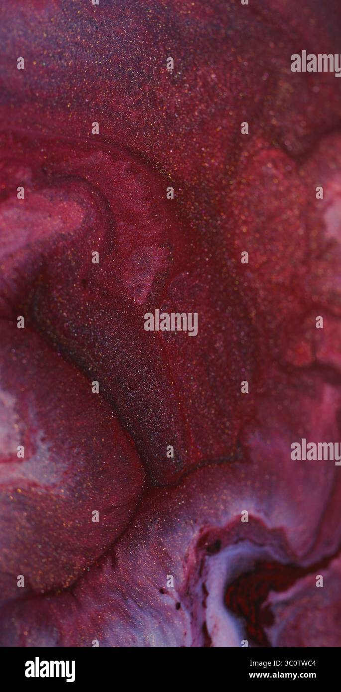 Fluid spill. Ink background. Defocused red pink purple color sparkling ...