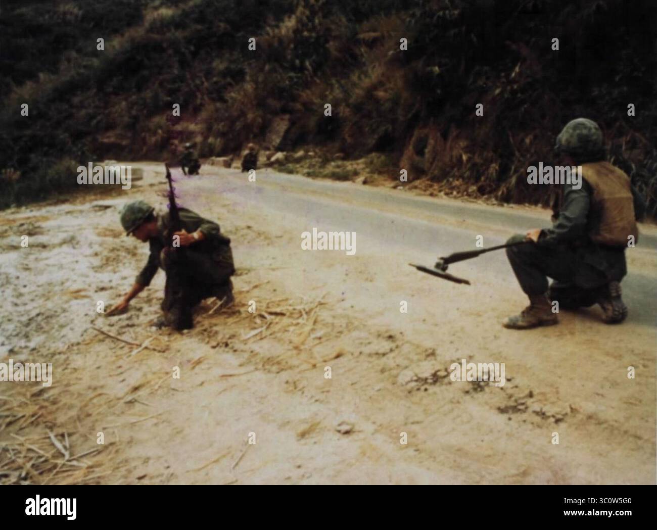 Members of the 35th Engineer Battalion sweep Hai Van Pass for mines ...