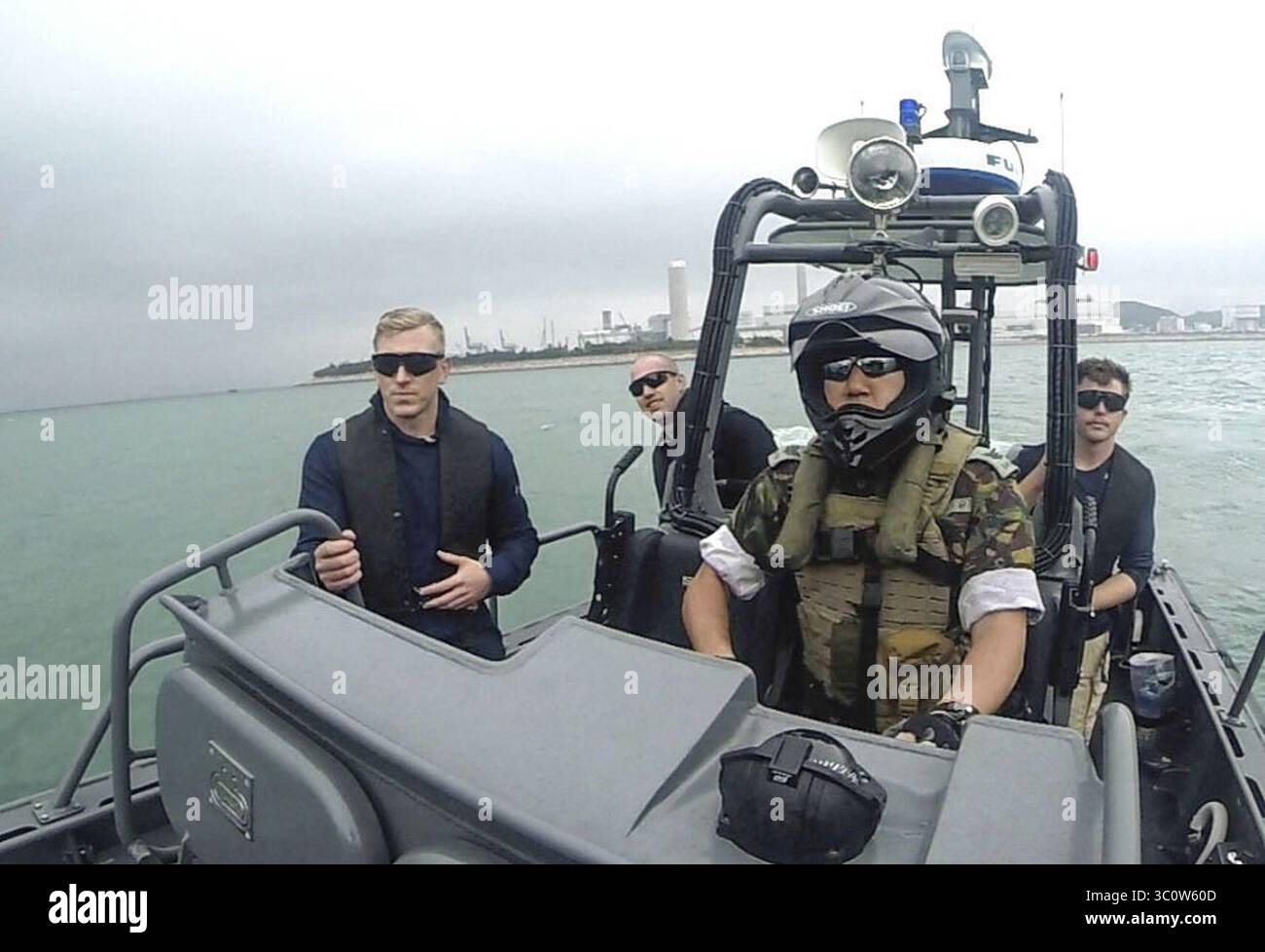 Members of the visit, board, search and seizure team from dock landing ...