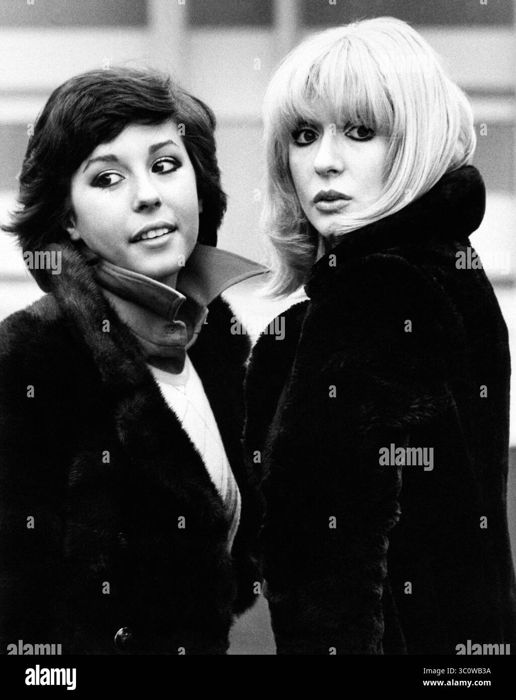 The Italian actress and singer Daniela Goggi (on the left) is posing ...
