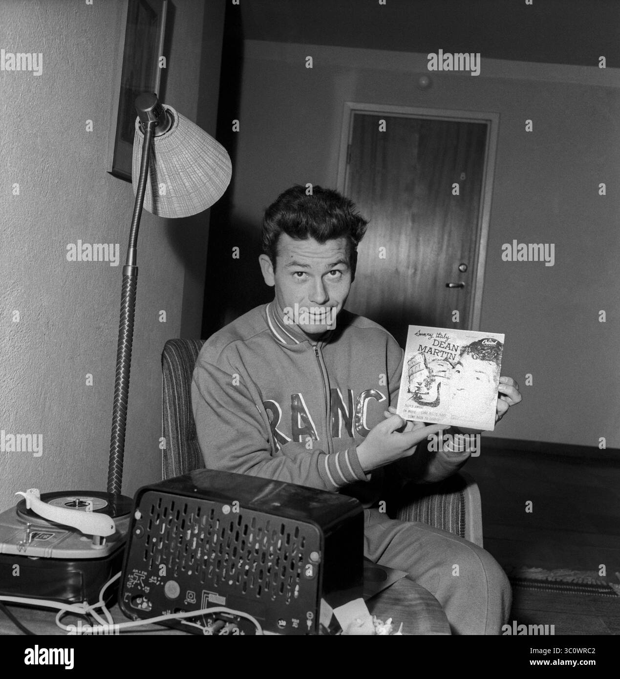 French football player Just Fontaine showing the cover of a Dean Martin ...