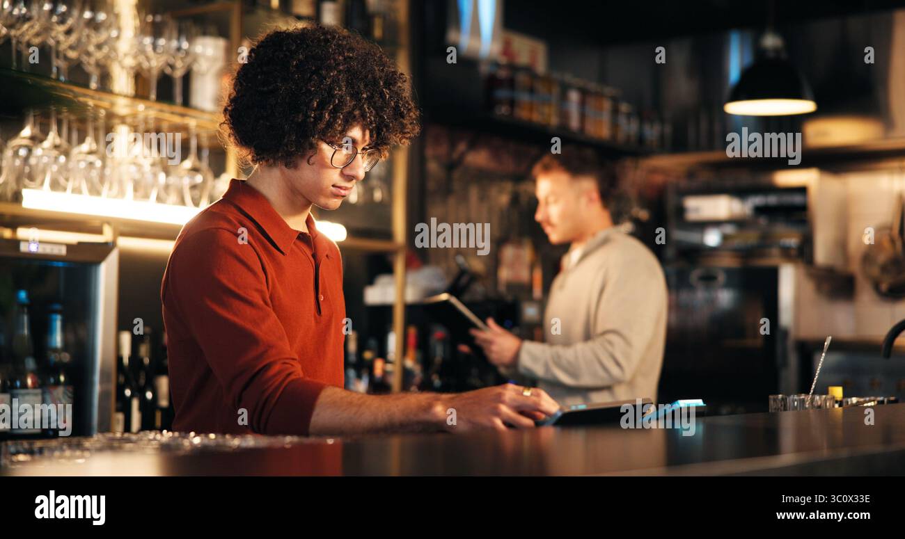 Business, man and bartender in restaurant, tablet and digital app for ...