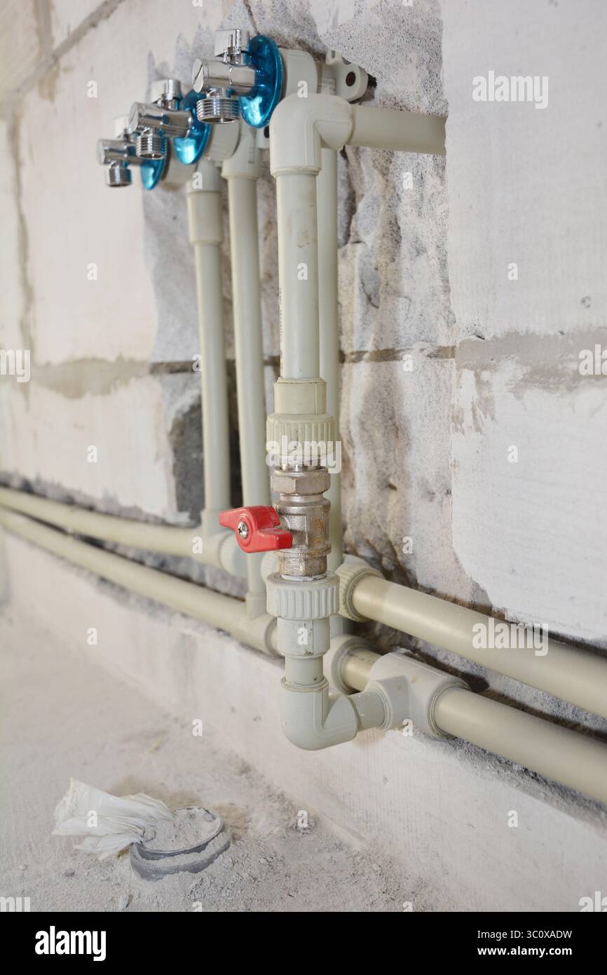 Installing and hide in wall water pipes in the house bath room. Groove ...