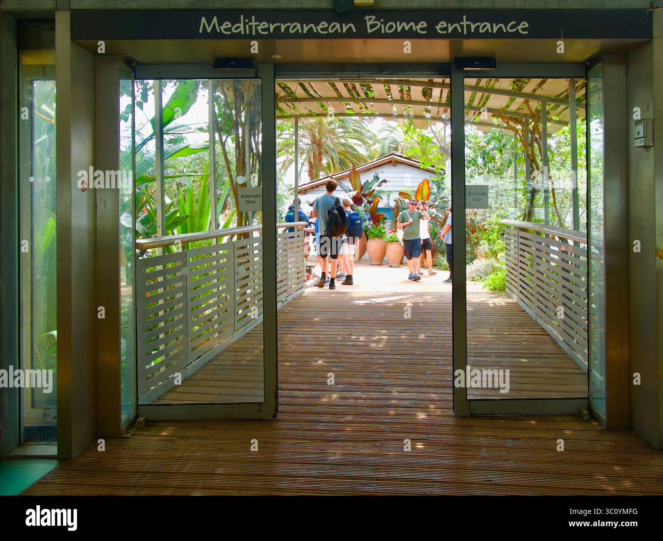Tourists inside the entrance to the Mediterranean biome The Eden ...