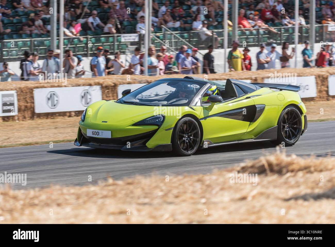 McLaren 600LT Spider convertible sports car driving up the hillclimb ...