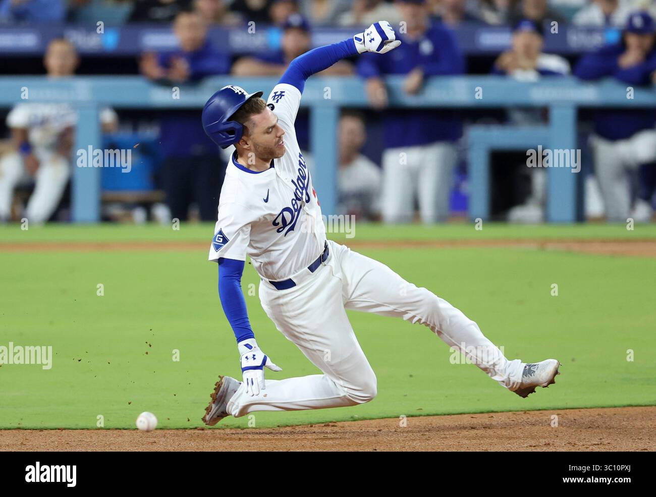 Los Angeles Dodgers' catcher Freddie Freeman slides into second base ...