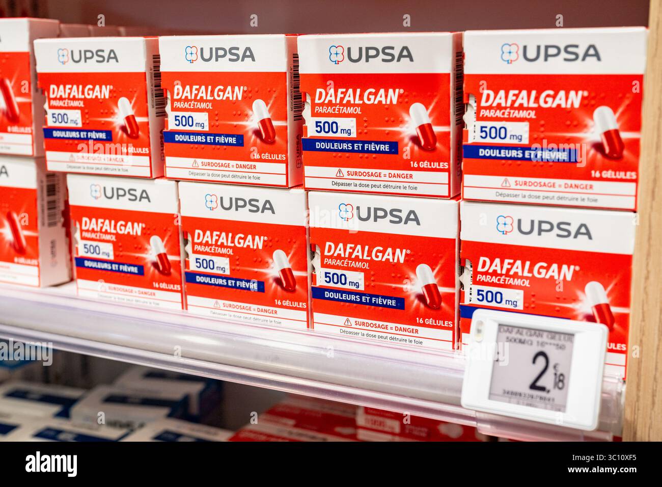Dafalgan UPSA boxes on shelves in a pharmacy, Upsa pharmaceutical ...