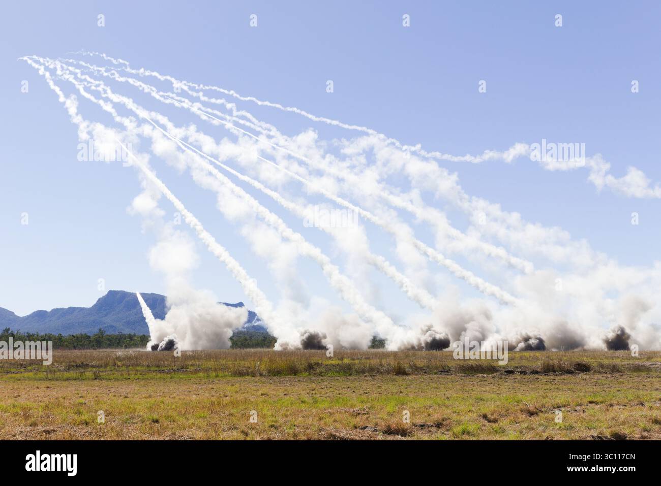 Rockets streak into the air from six M142 High Mobility Artillery ...