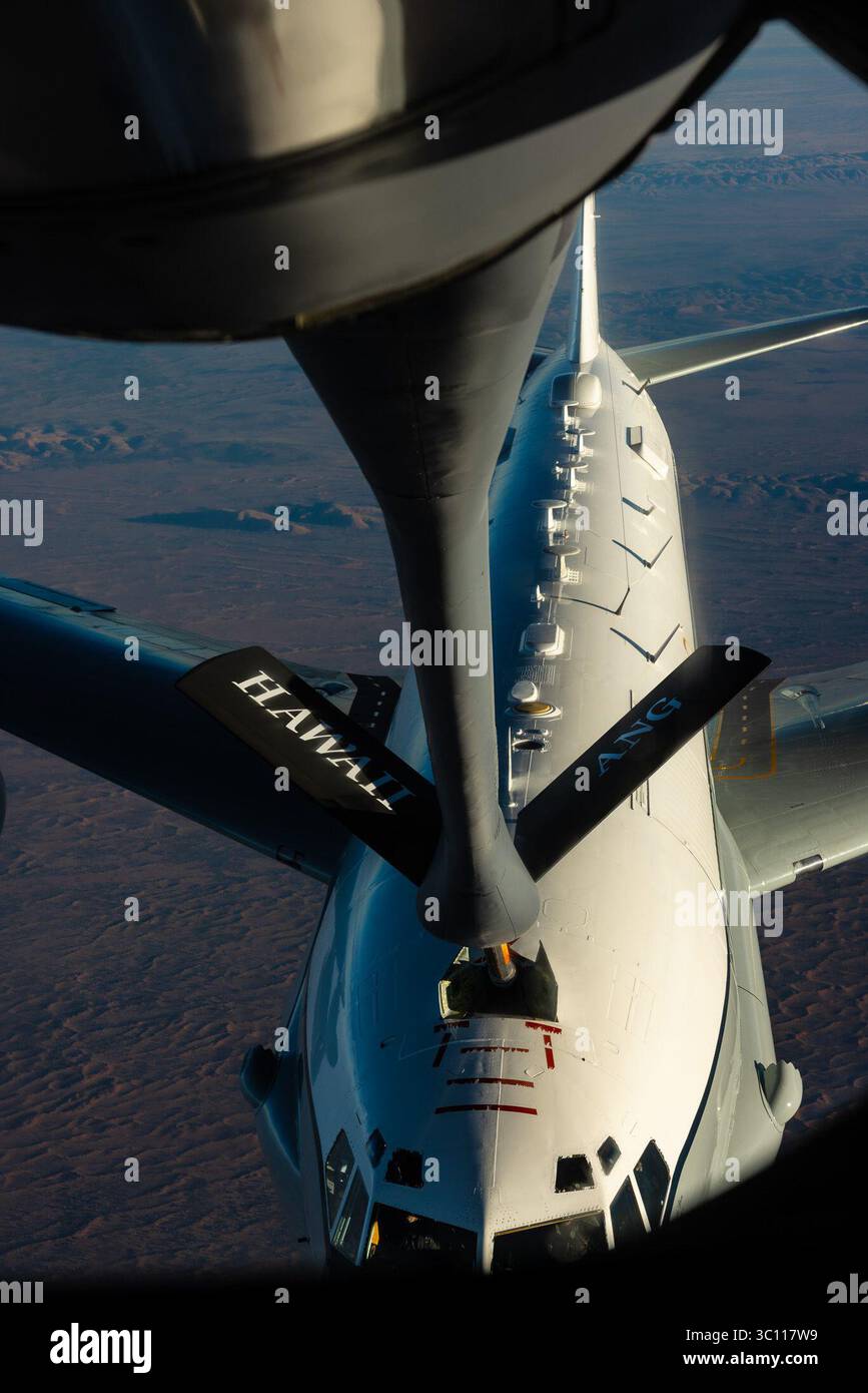 U.S. Air Force KC-135 Stratotanker refuels a RC-135V/W Rivet Joint ...
