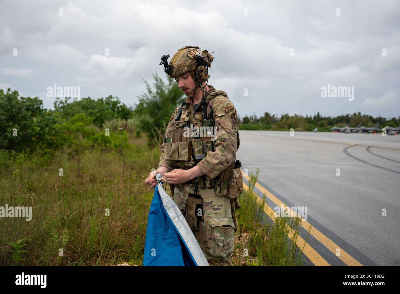 U.S. Air Force Senior Airman Connor Brown, 673rd Security Forces Squadron patrolman, sets up a ...
