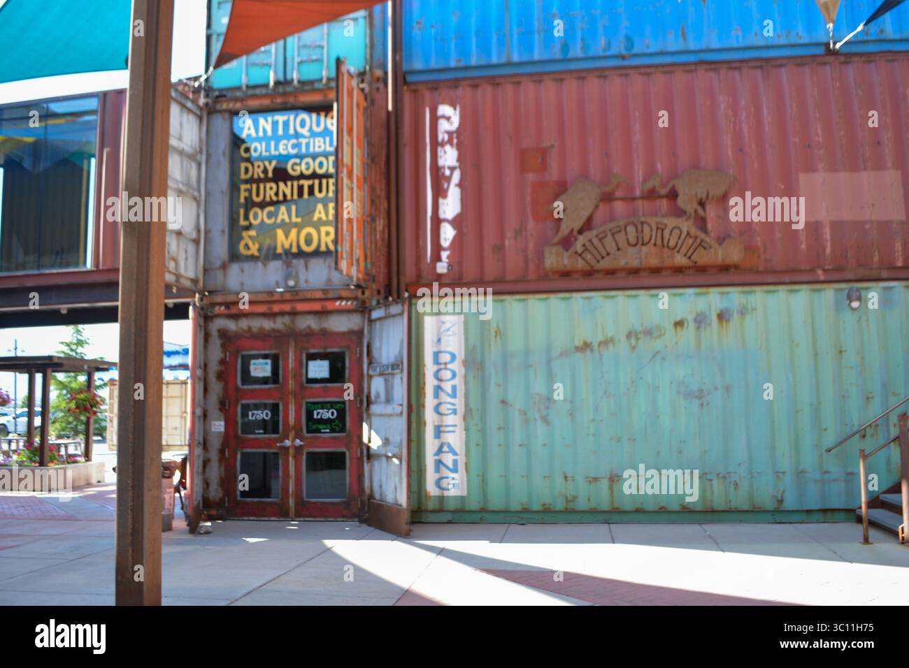 Container house in a fancy environment with ferris wheel in front Stock ...