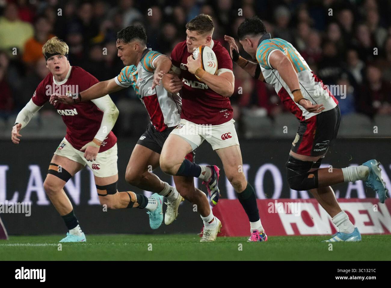 Garry Ringrose of the British & Irish Lions, second right, attempts to ...