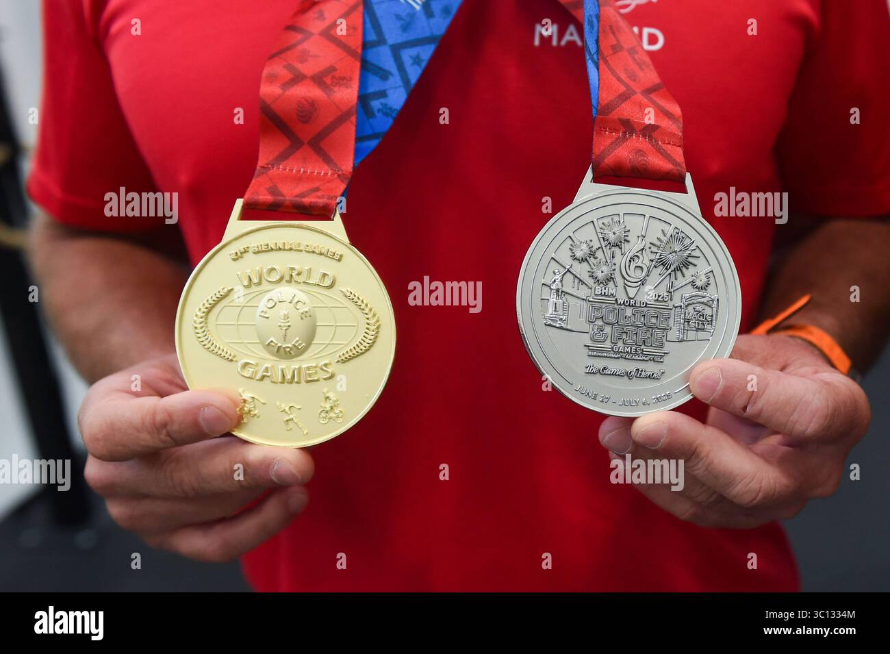 A firefighter shows his medals won at the World Police and Firefighter ...