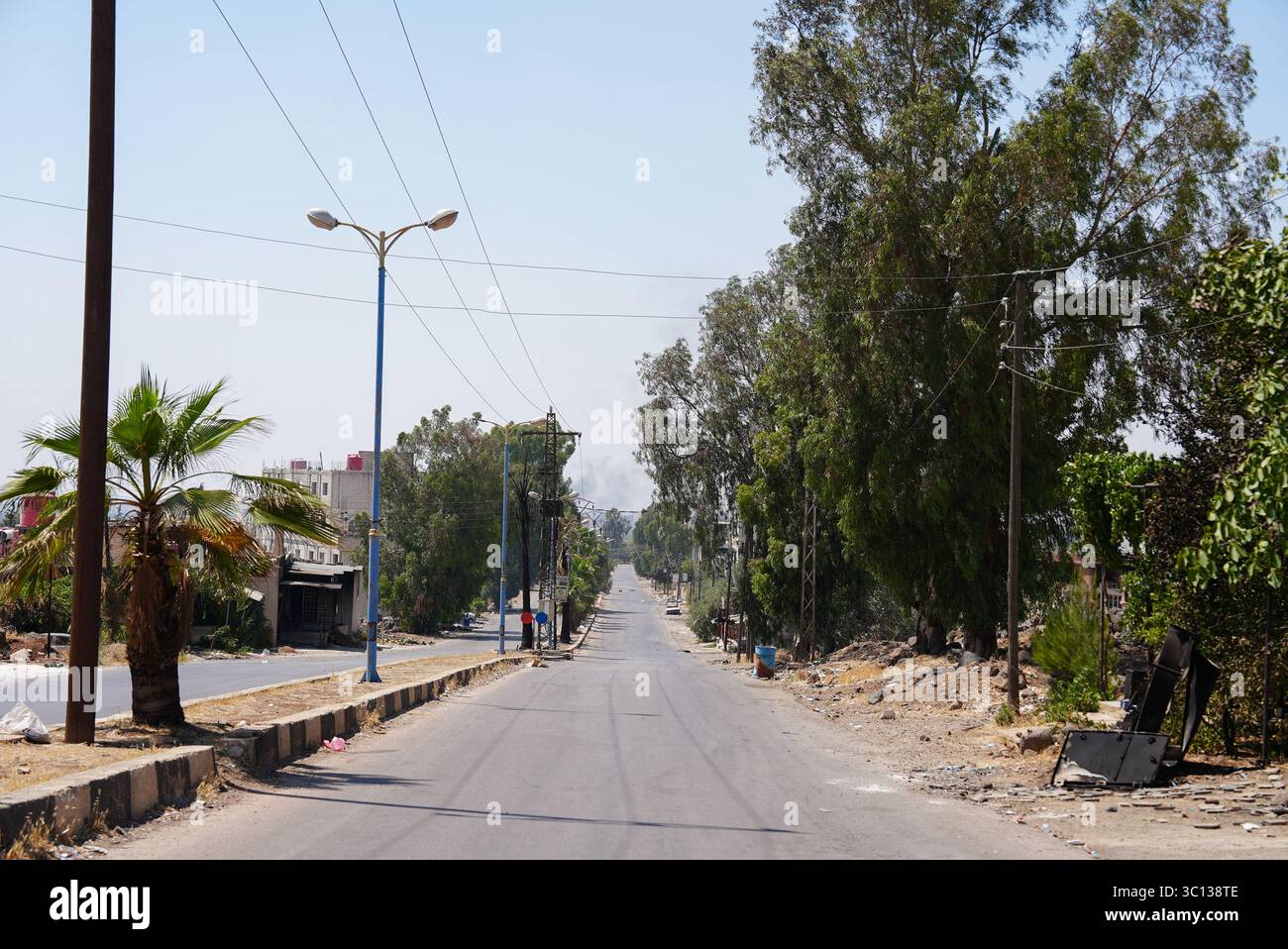 Burned buildings and vehicles are seen in Sweida, Syria, on July 20 ...