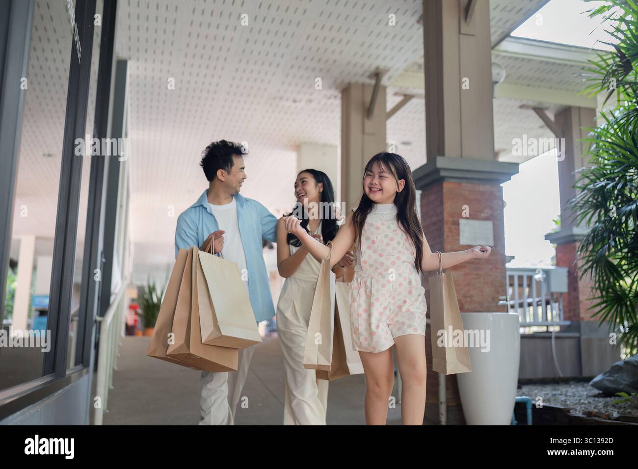 Family shopping trip local mall candid moments outdoor space joyful ...