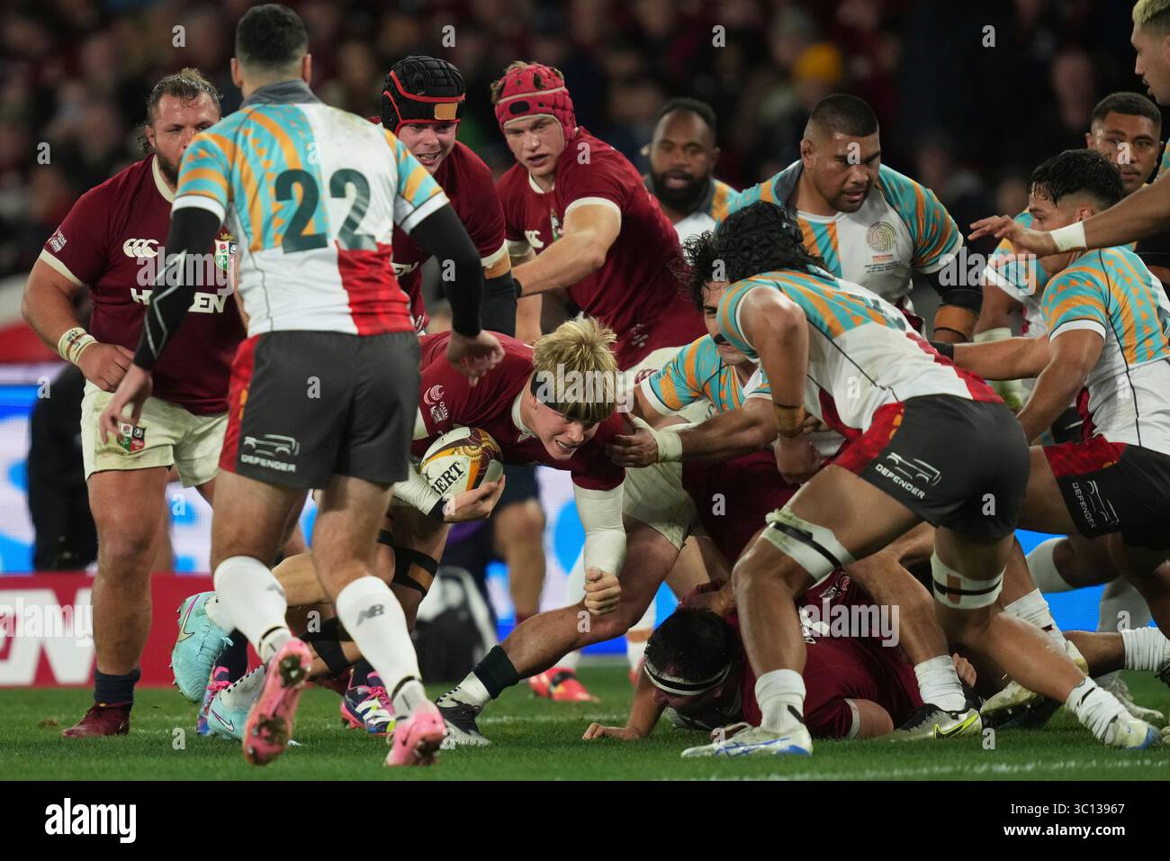 Henry Pollock of the British & Irish Lions, center, gets low while ...