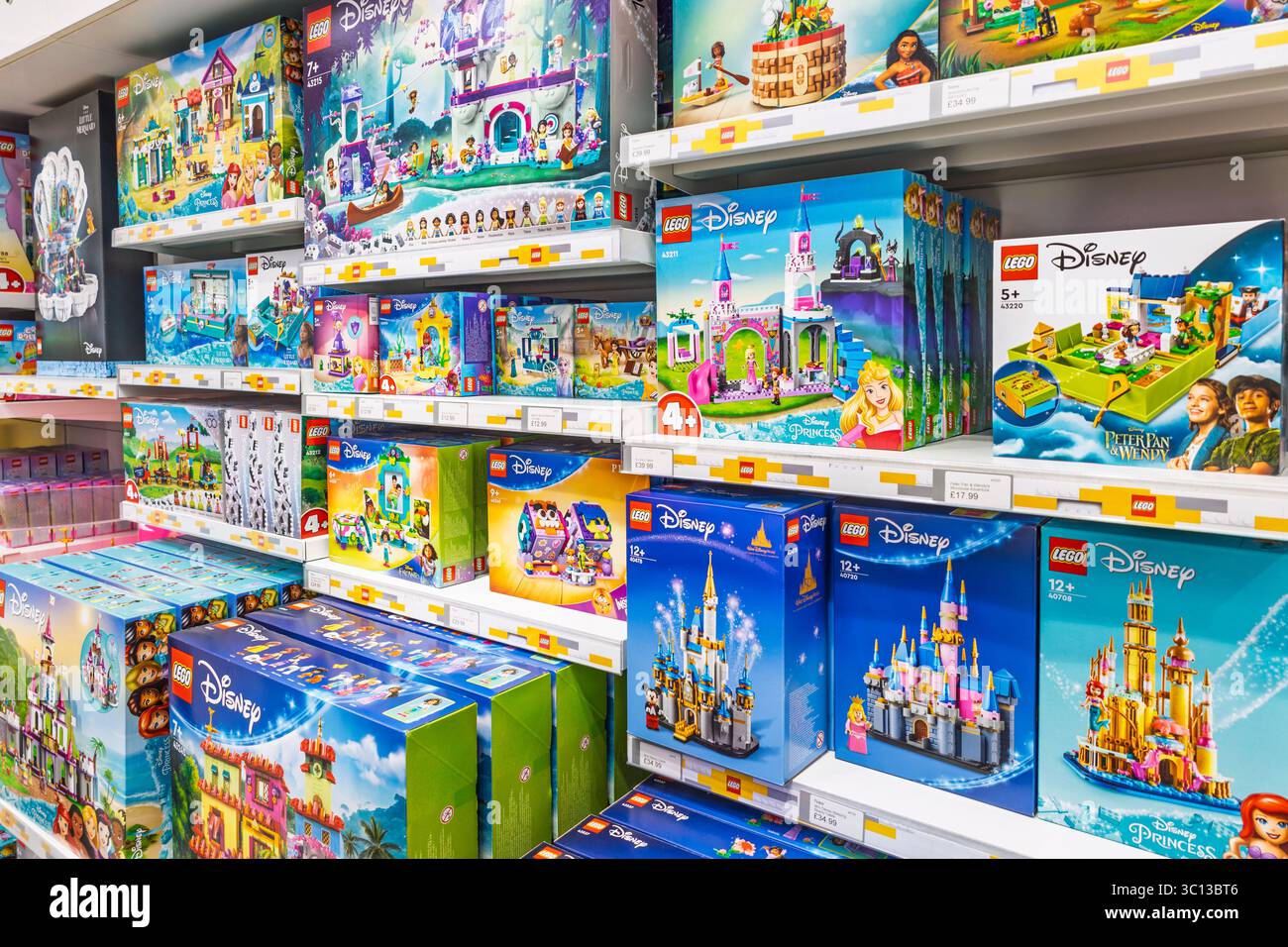 Colorful LEGO playsets on retail shelves, Disney and City themed boxes ...