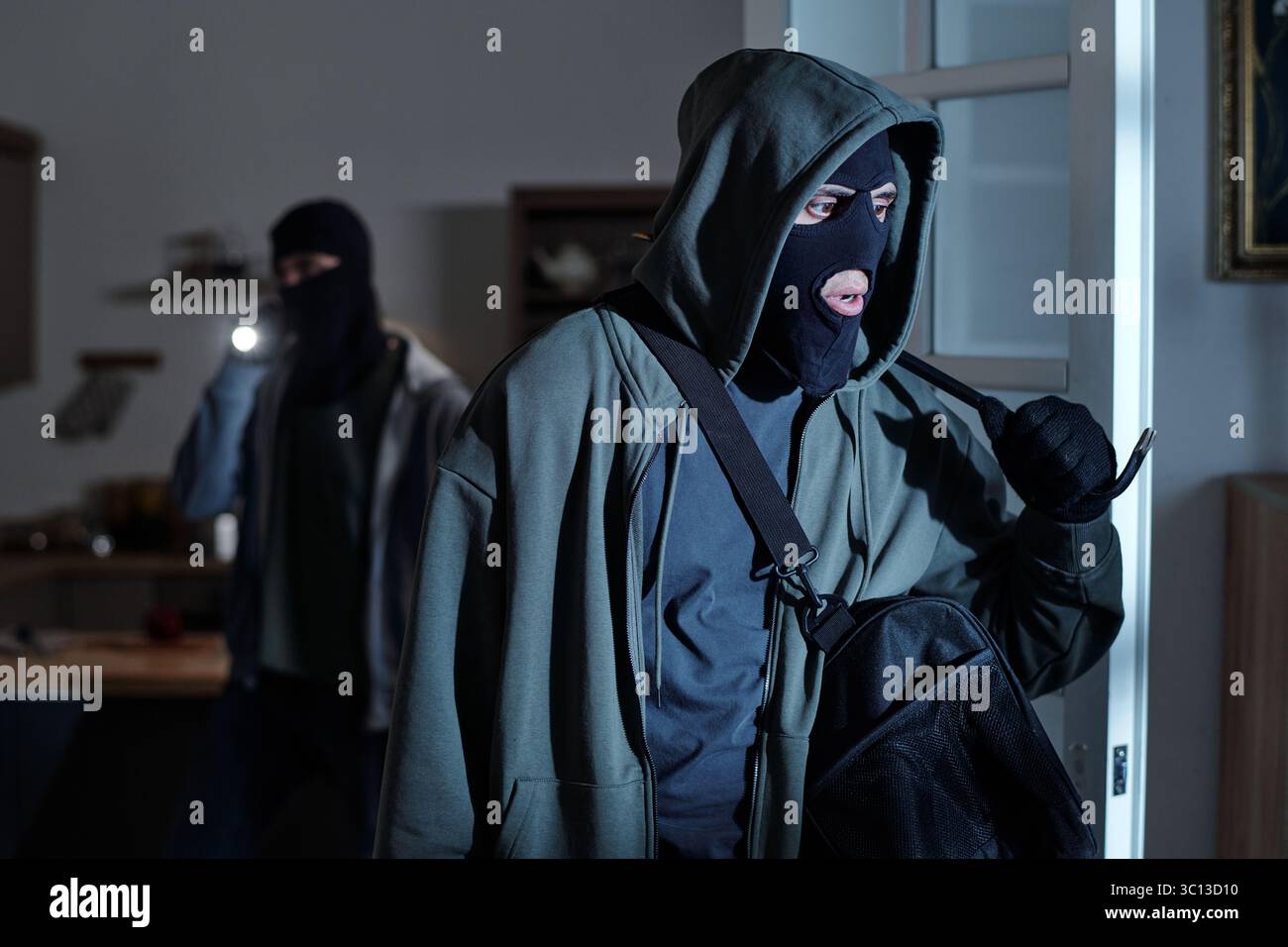 Men Wearing Masks Breaking into House during Nighttime Robbery Stock ...