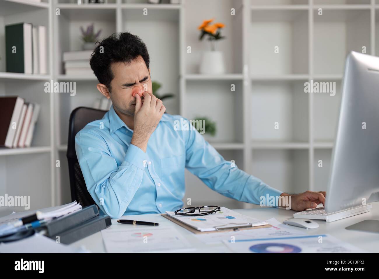 Sick employee struggles at desk office environment work stress indoor ...