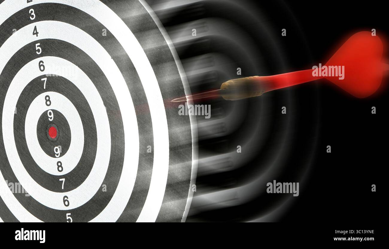 Dart flying into center of target against black background, motion blur ...