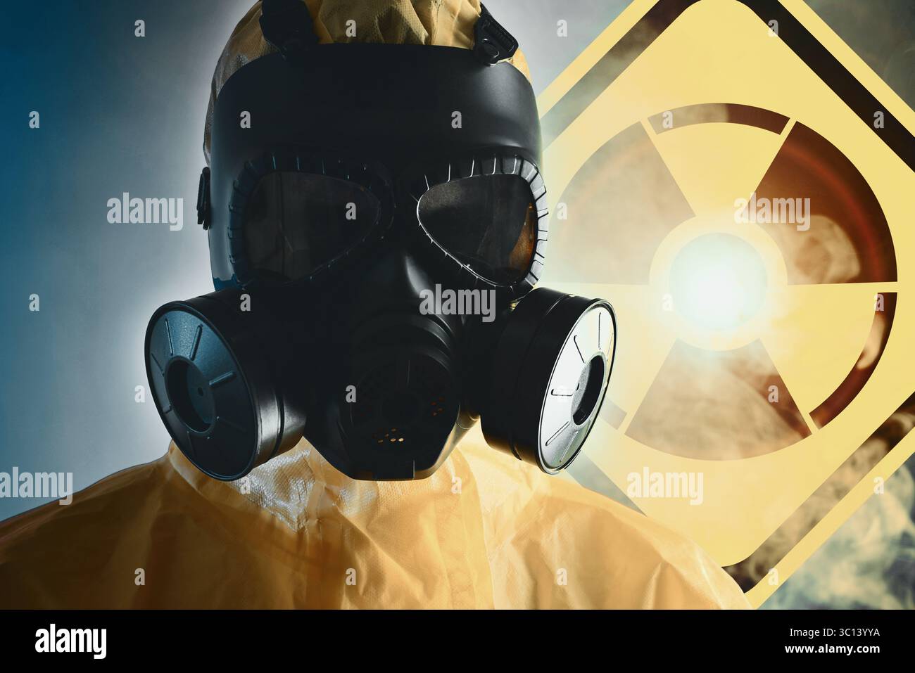 Man wearing hazmat suit and gas mask in smoke. Glowing radioactive sign ...