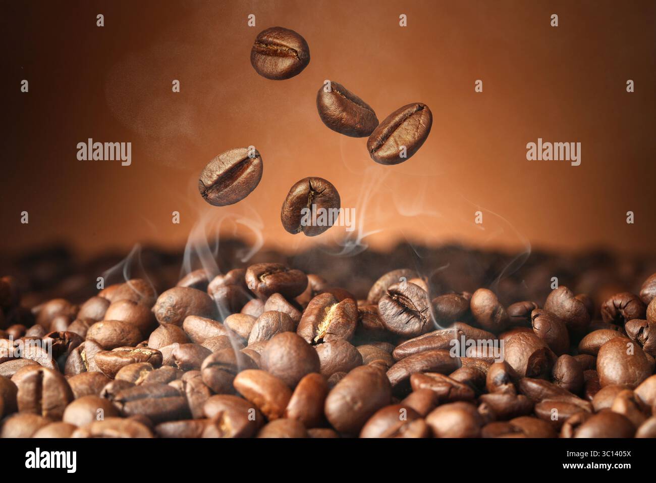 Roasted coffee beans falling against brown background, closeup Stock ...