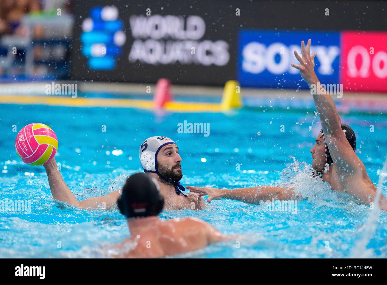 Serbia's Milos Cuk, left, tries to attempts to score against Hungary's ...