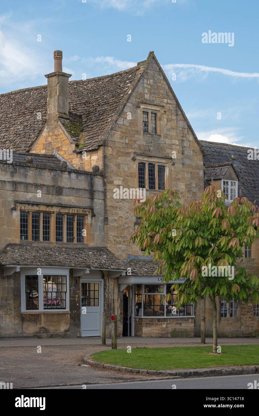 Traditional Cotswold stone buildings with stone slate roofs in the ...