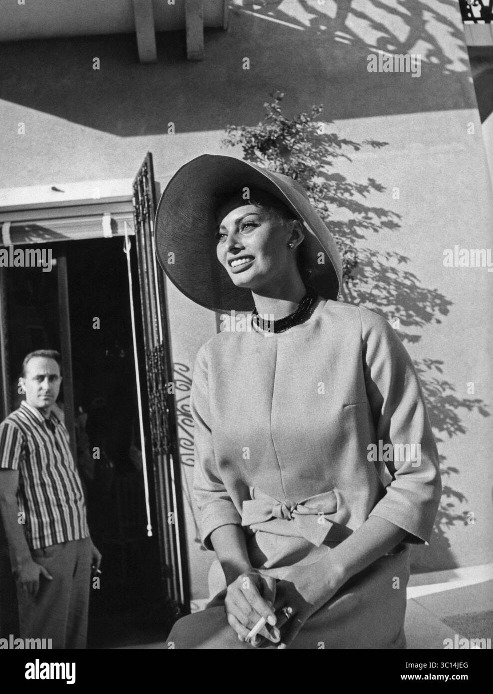 Italian actress Sophia Loren (Sofia Villani Scicolone) smiling smoking ...
