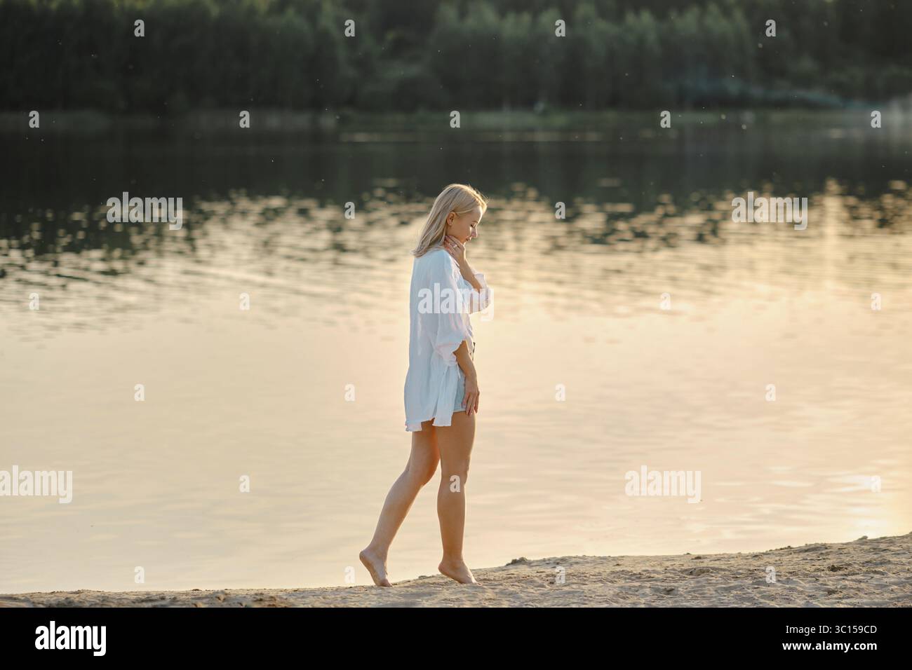Pensive woman strolls barefoot hi-res stock photography and images - Alamy