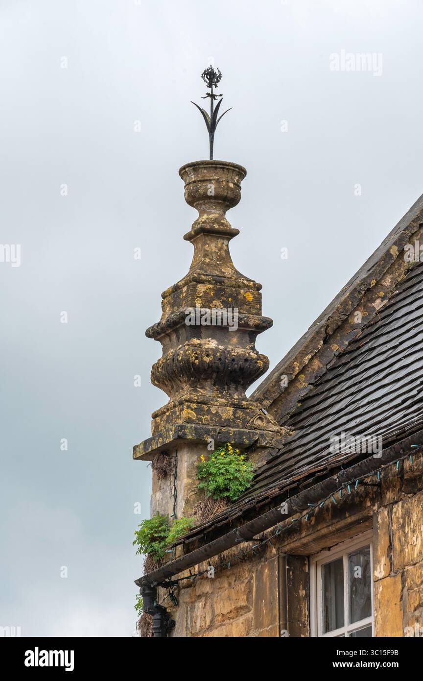 An artistic flourish to a finial on the roof of a building, in the ...