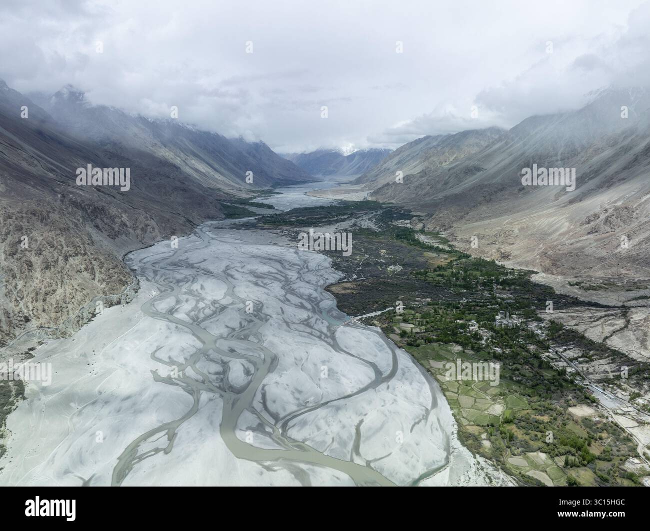 Aerial view of a braided river snaking through the rugged, arid ...