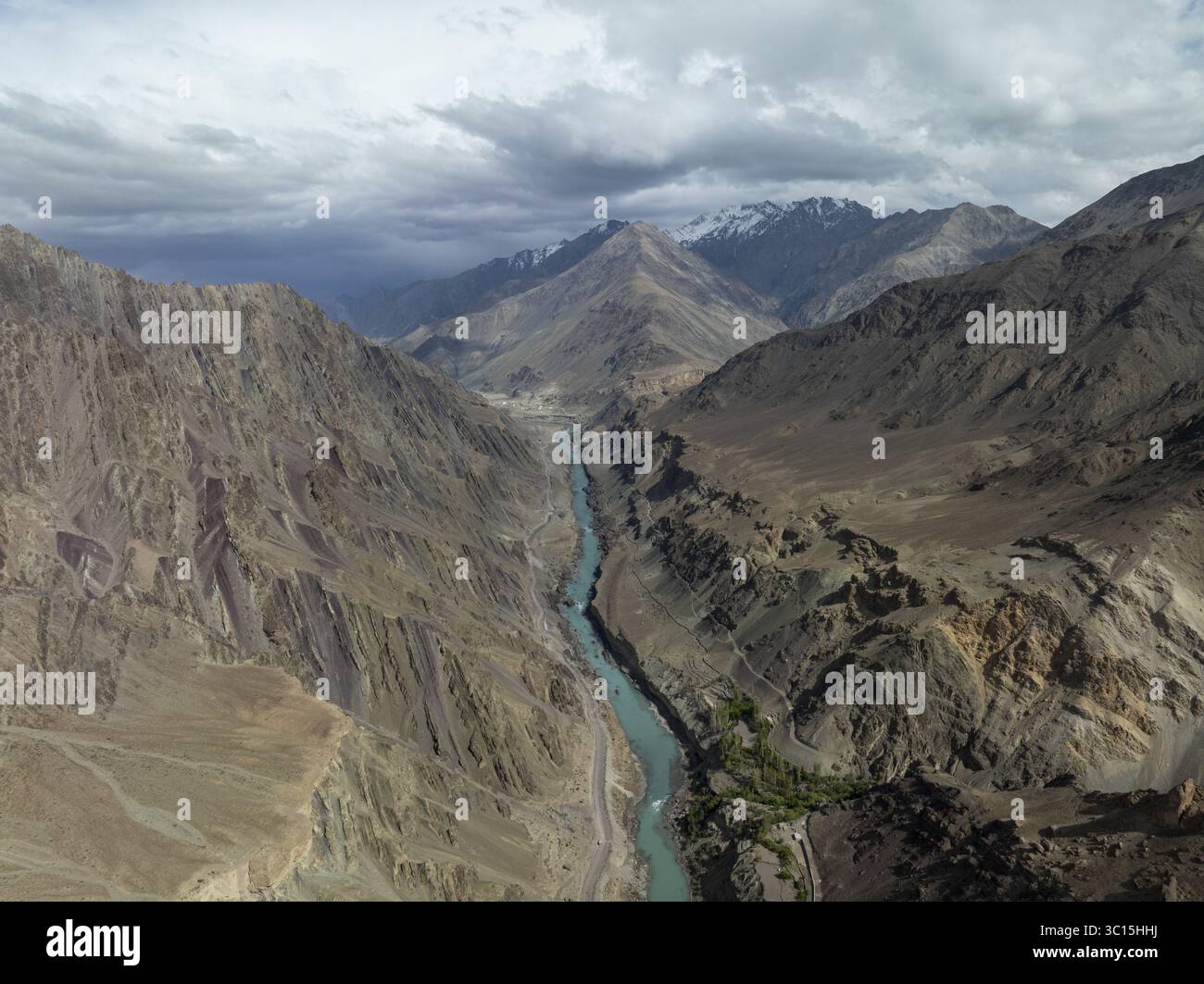 Aerial view of the Indus River snaking through rugged, sun-kissed ...