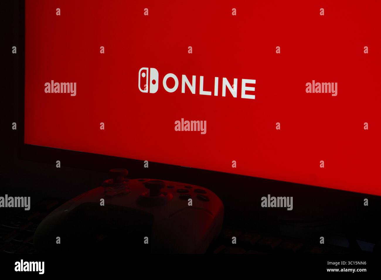 Nintendo Online logo on red screen with controller silhouette below ...