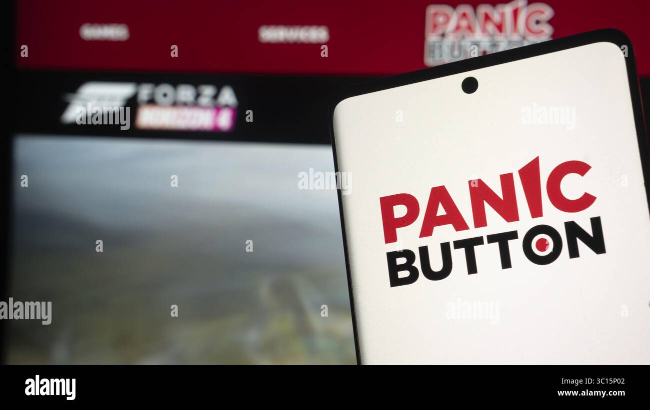 A phone screen displaying the Panic Button logo against a gaming setup ...