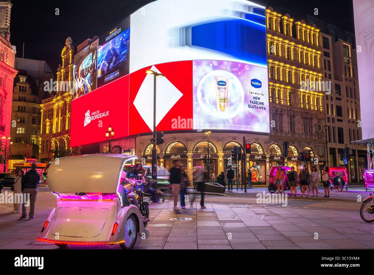 Piccadilly Circus at night, London, England, UK. The large, bright ...