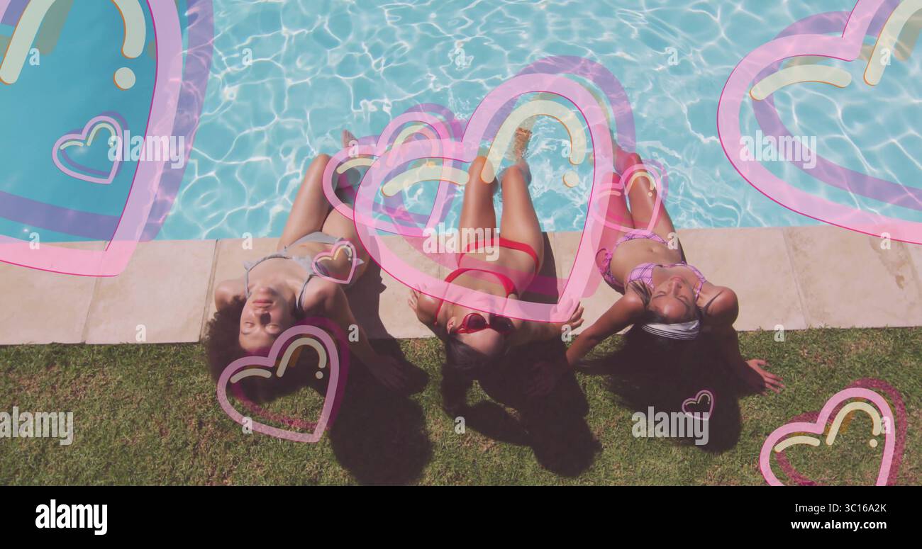 Reclining three women in bikinis and sunglasses extending legs into ...