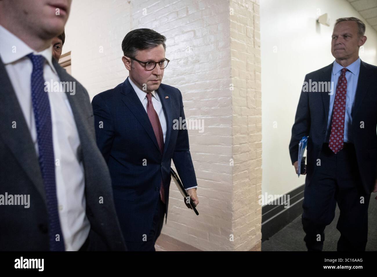 House Speaker Mike Johnson (R-La.) crosses paths with Rep. Scott Perry ...
