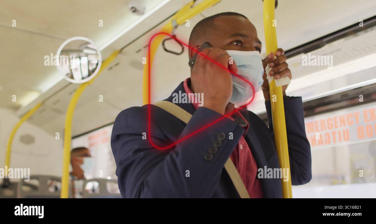 Standing man talking on smartphone and holding yellow handrail inside ...