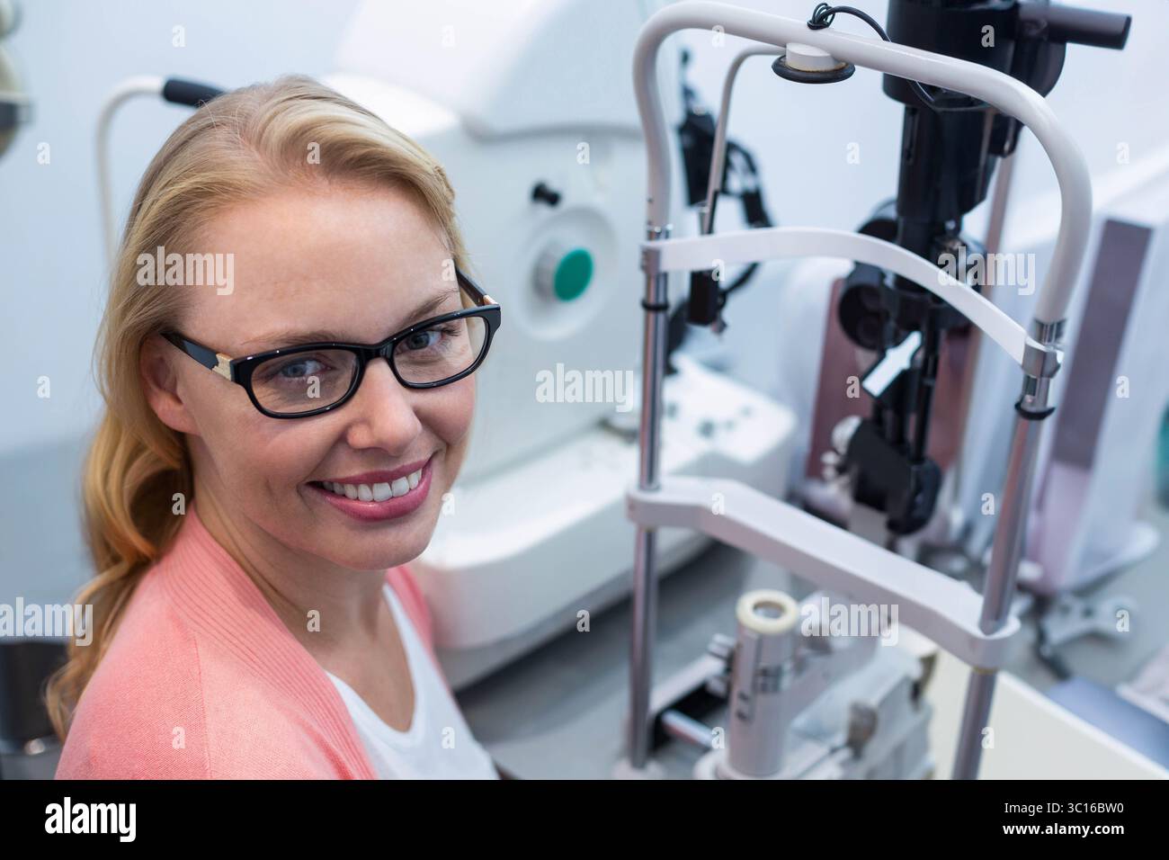 Slit lamp microscope waiting on exam table in eye clinic, with chin ...