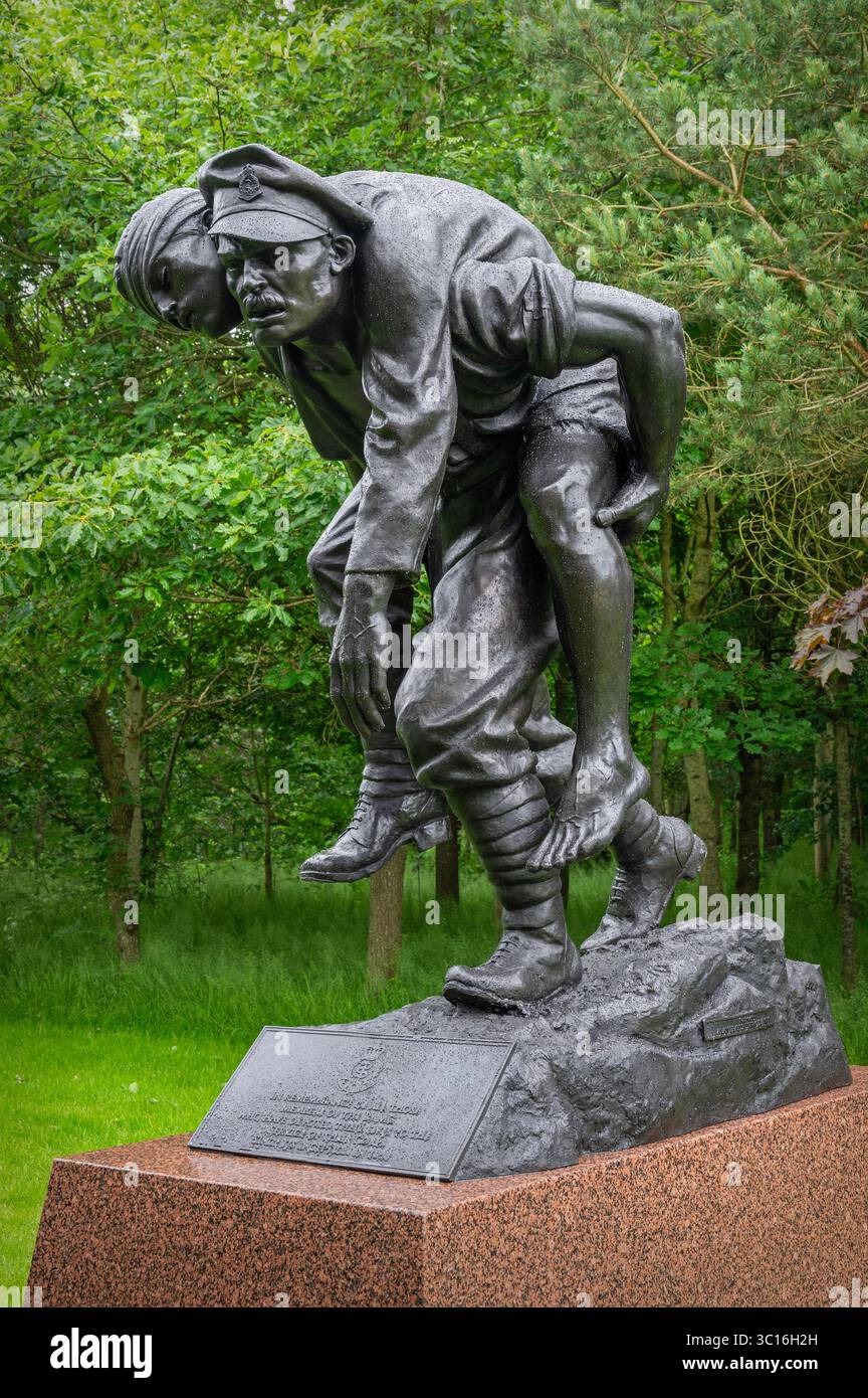 The Royal Army Medical Corps (RAMC) Memorial of a medic carrying a ...